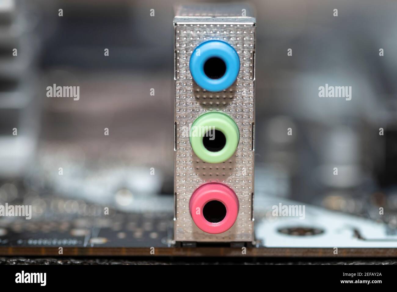 The rear panel of a desktop computer motherboard with visible audio ...