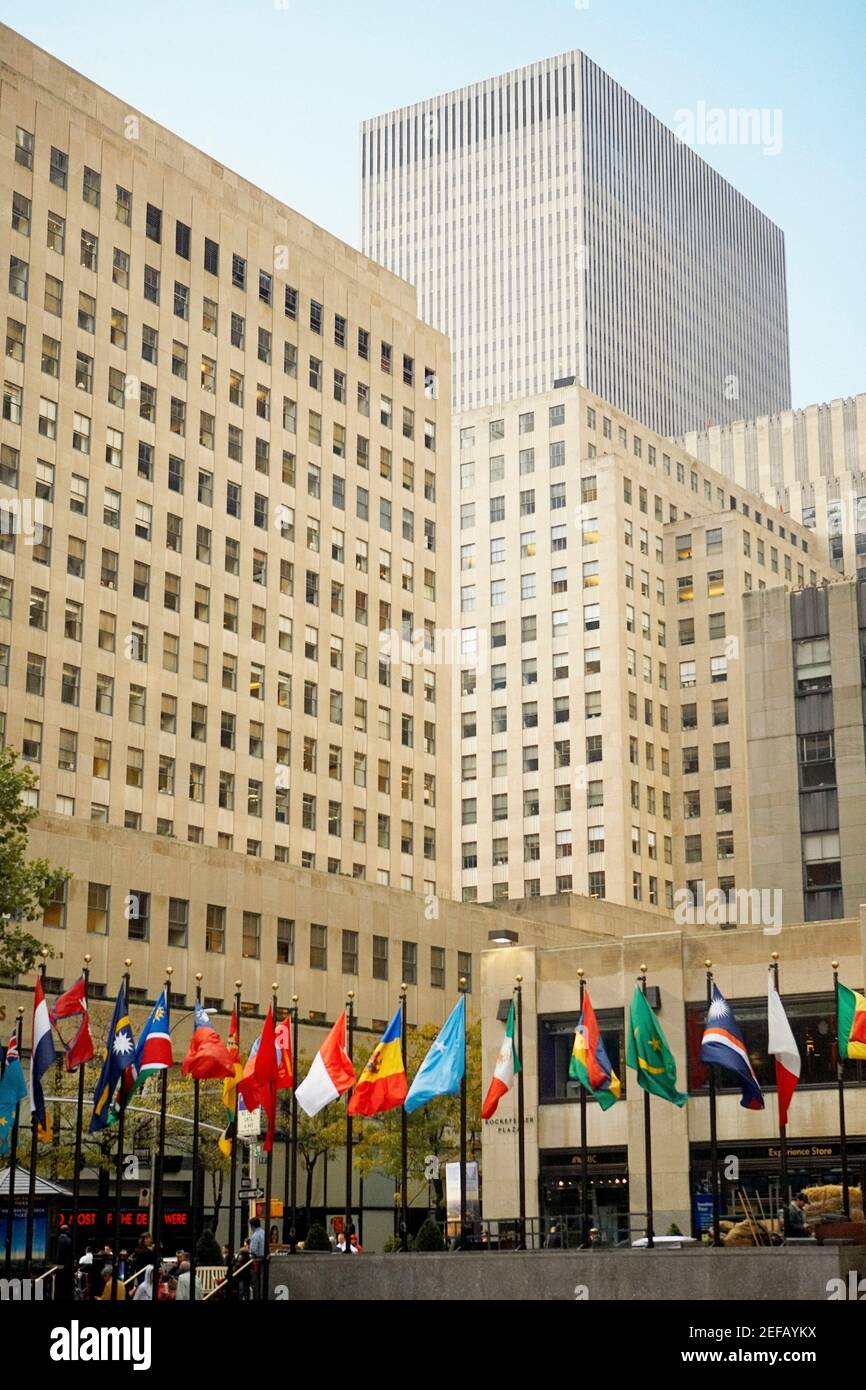 Flags in front of a building, Rockefeller Center, Manhattan, New York ...