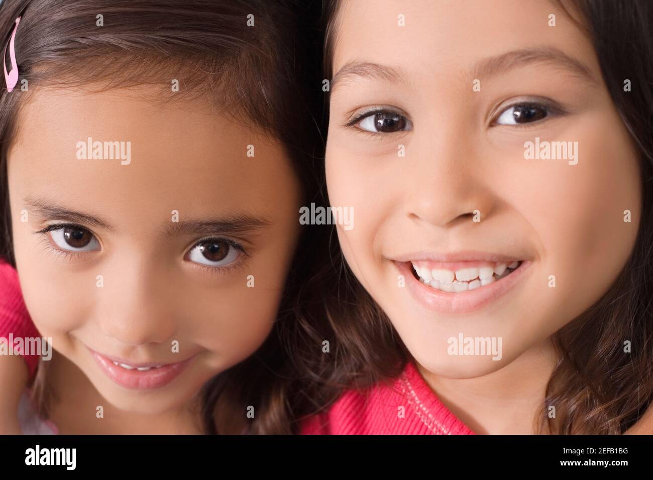 Portrait of two girls smiling Stock Photo - Alamy