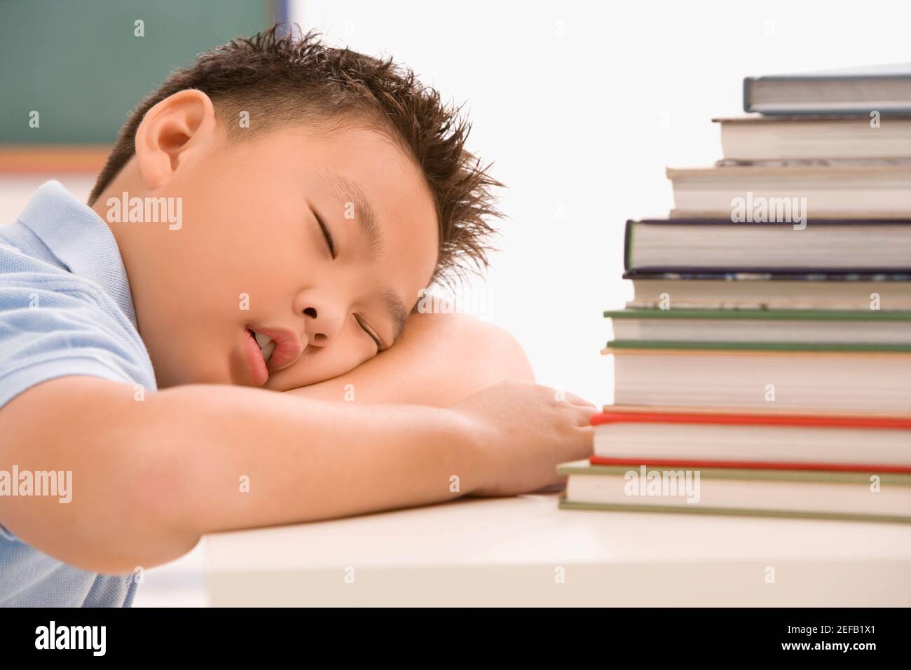 Close up of a schoolboy napping in a classroom Stock Photo - Alamy