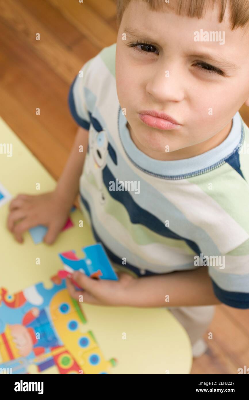 Child puzzle alone hi-res stock photography and images - Alamy