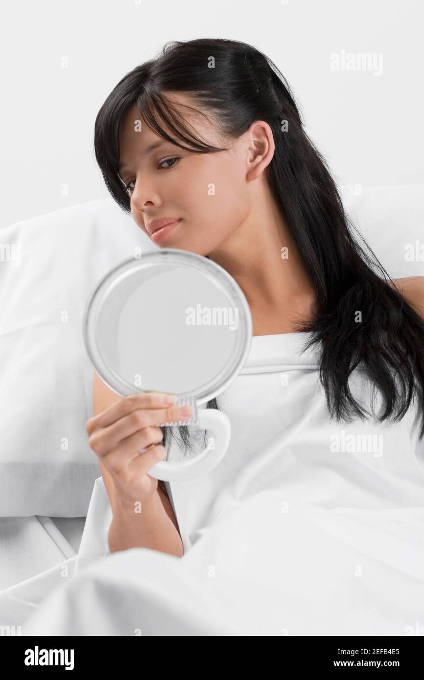 Patient looking at a mirror Stock Photo - Alamy