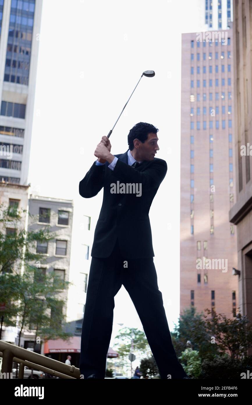 Business executive playing golf hi-res stock photography and images - Alamy