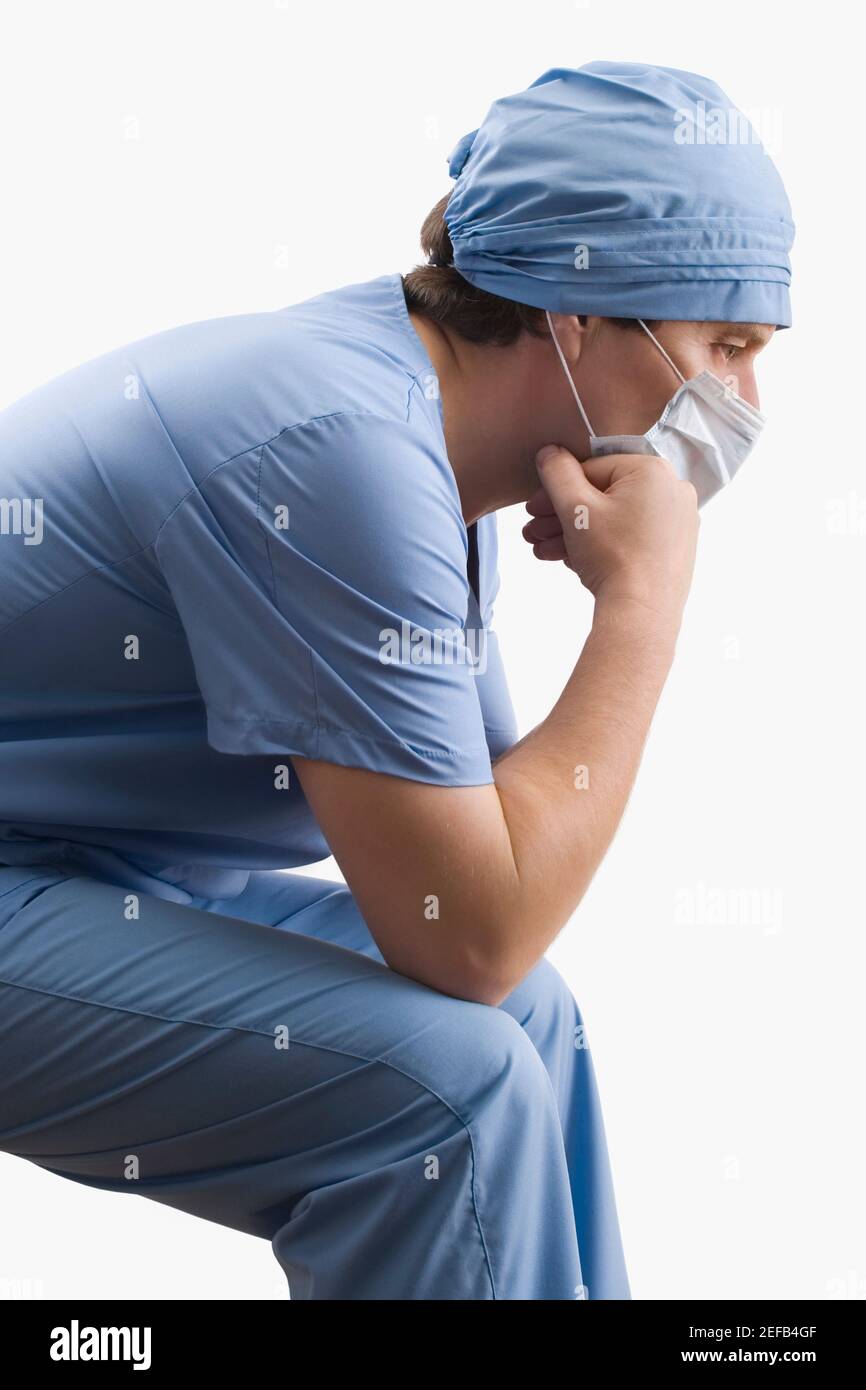 Side profile of a male surgeon thinking Stock Photo - Alamy