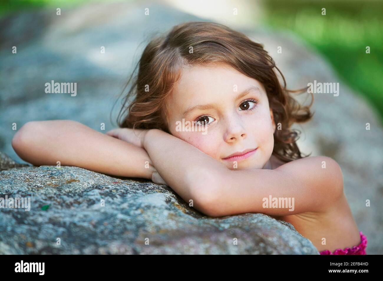 Girl leaning a rock hi-res stock photography and images - Alamy