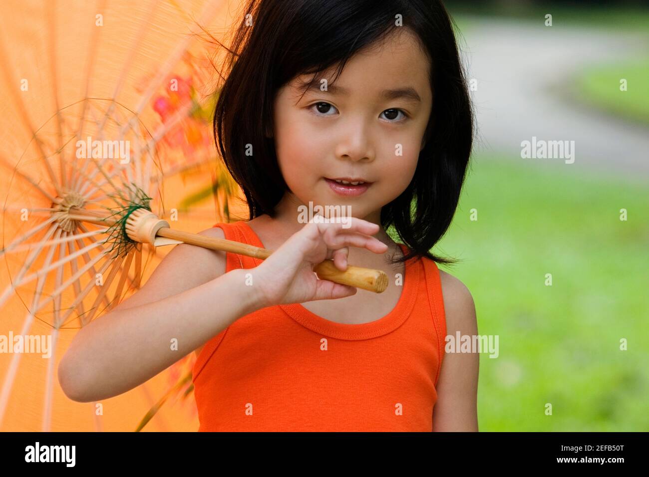 Portrait of a girl holding a parasol Stock Photo - Alamy