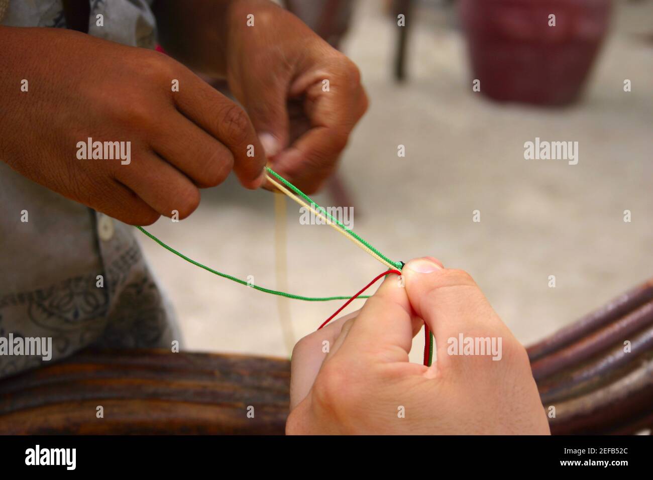 Two hands holding wire hi-res stock photography and images - Alamy