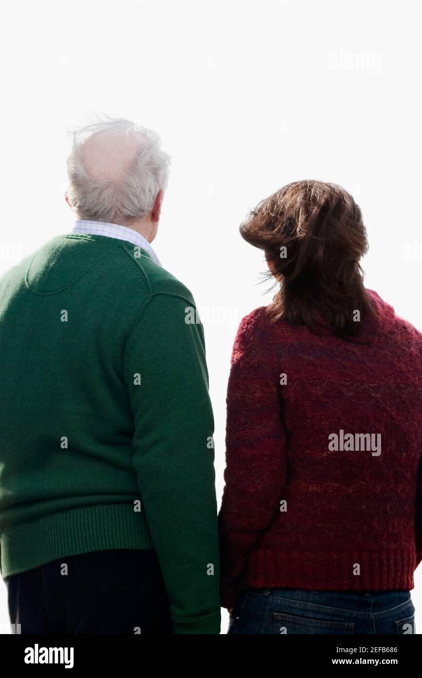 Rear view of a couple standing together Stock Photo - Alamy