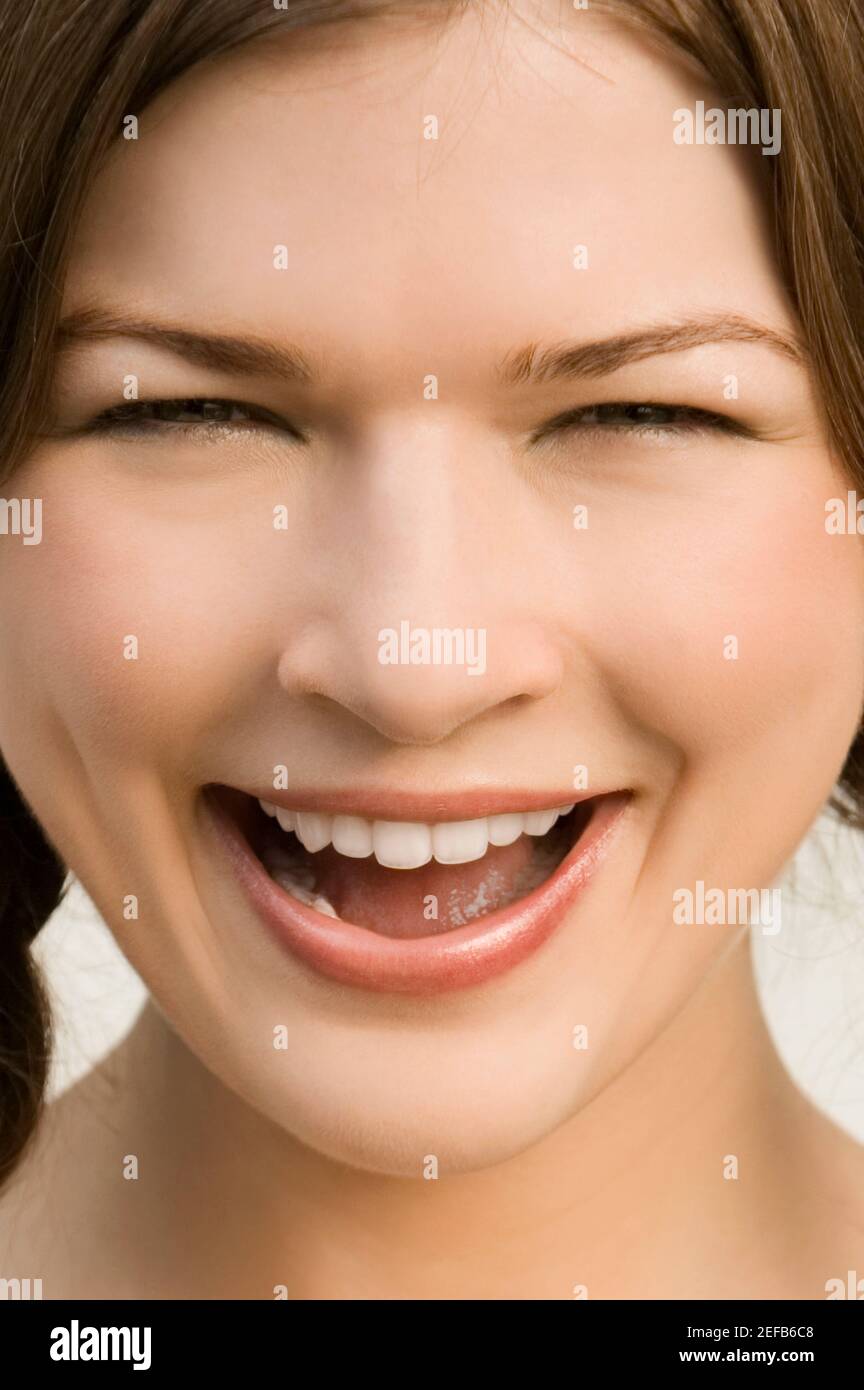 Portrait of a young woman laughing Stock Photo - Alamy