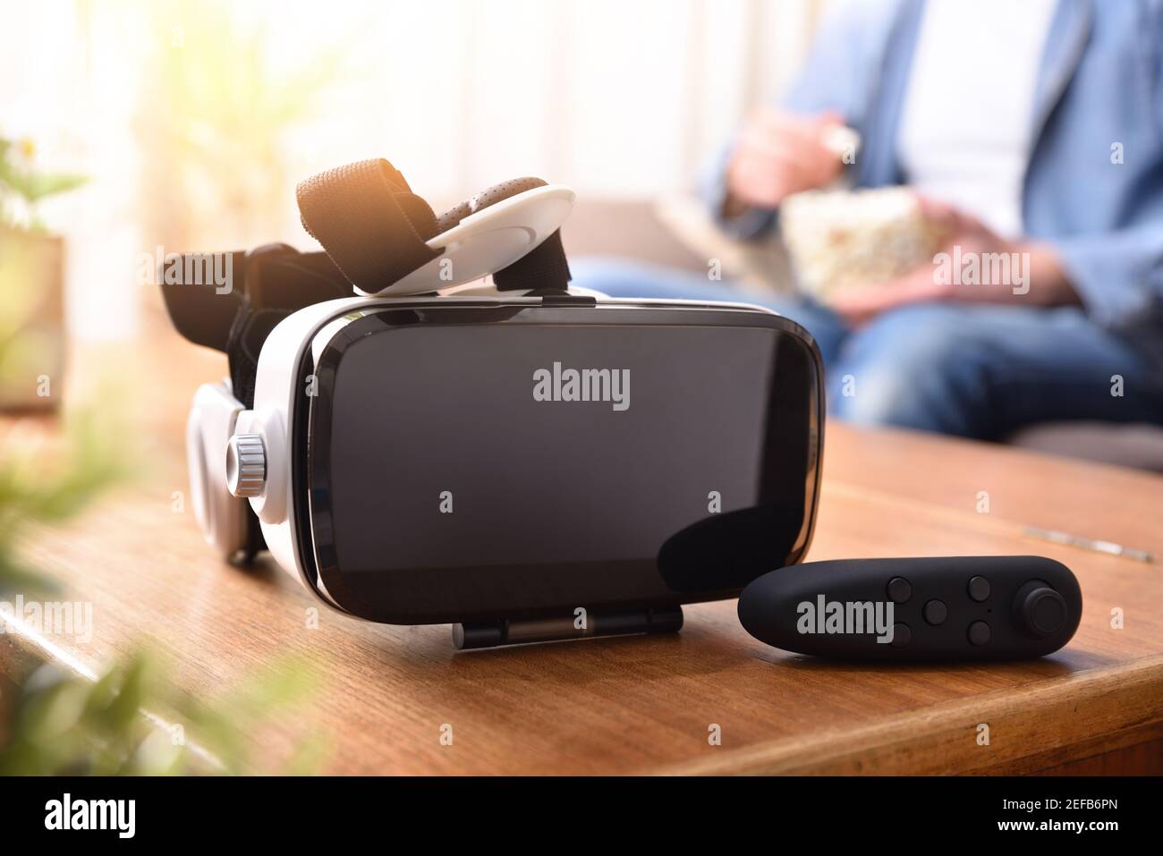 White and black virtual reality headset and joystick controller on ...