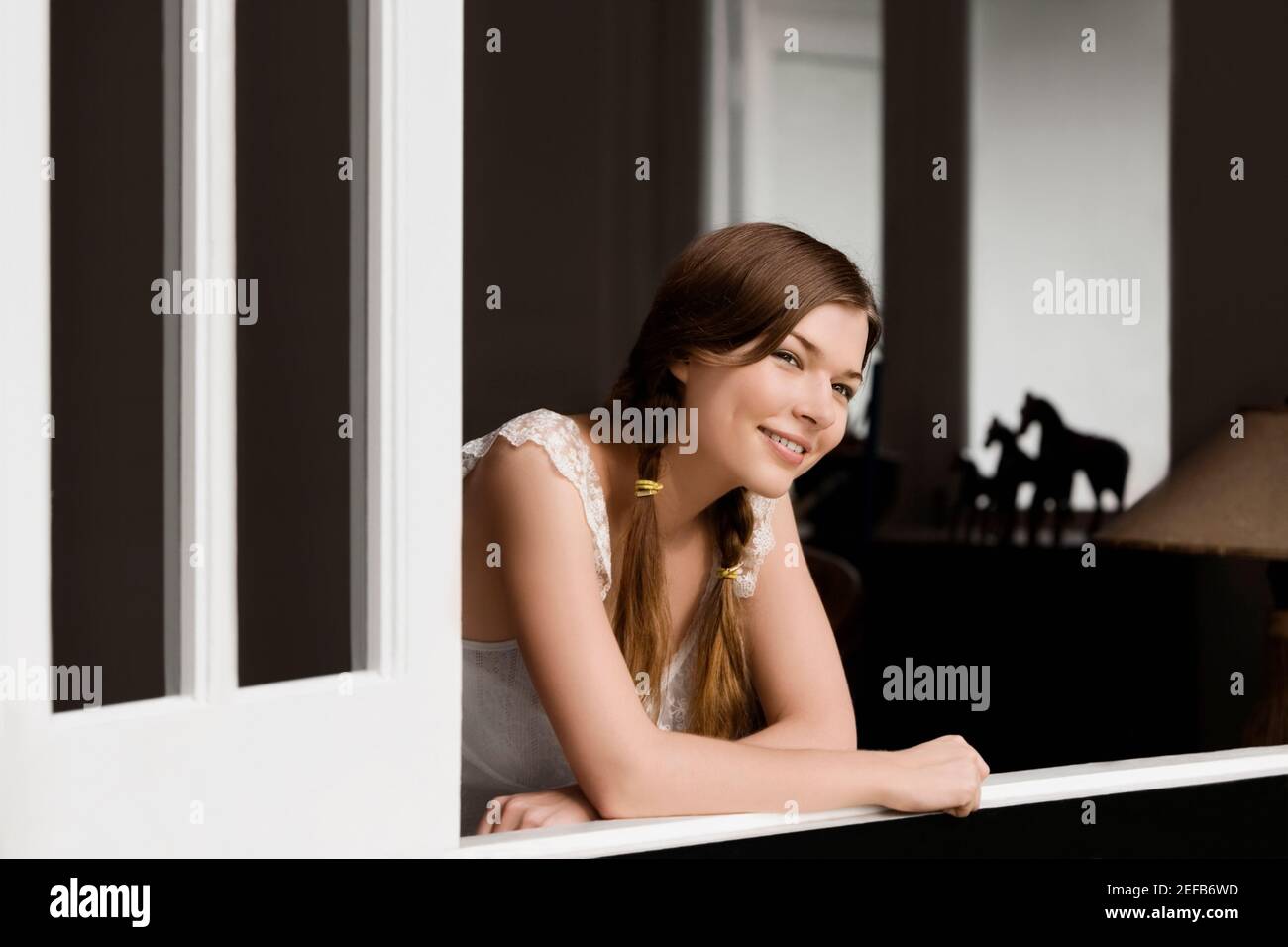 Leaning on a window hi-res stock photography and images - Alamy