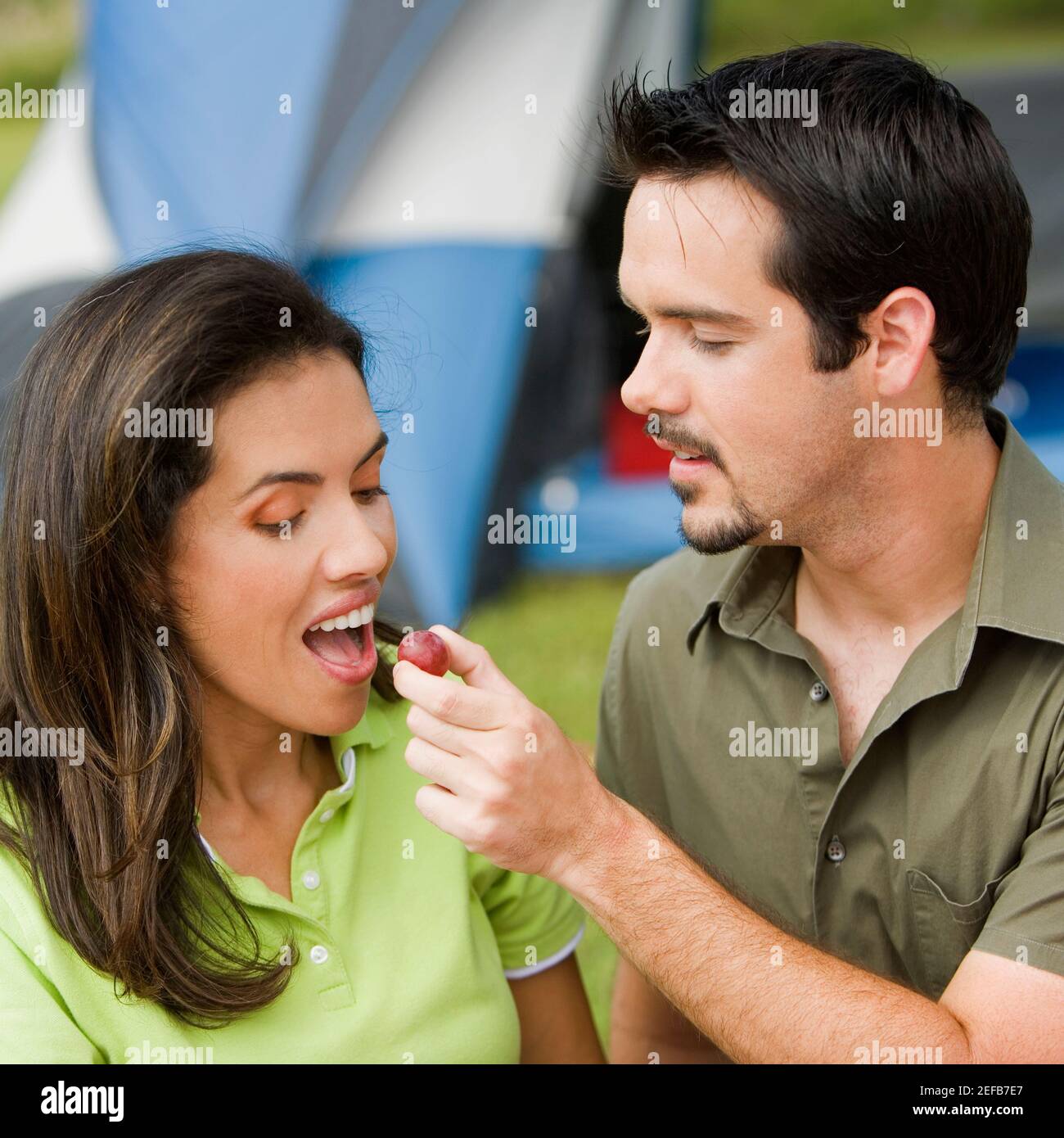 Couple woman feeding man cherry hi-res stock photography and images - Alamy
