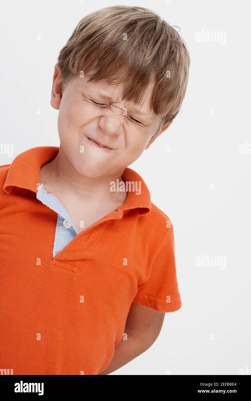 Close up of a boy biting his lips Stock Photo - Alamy