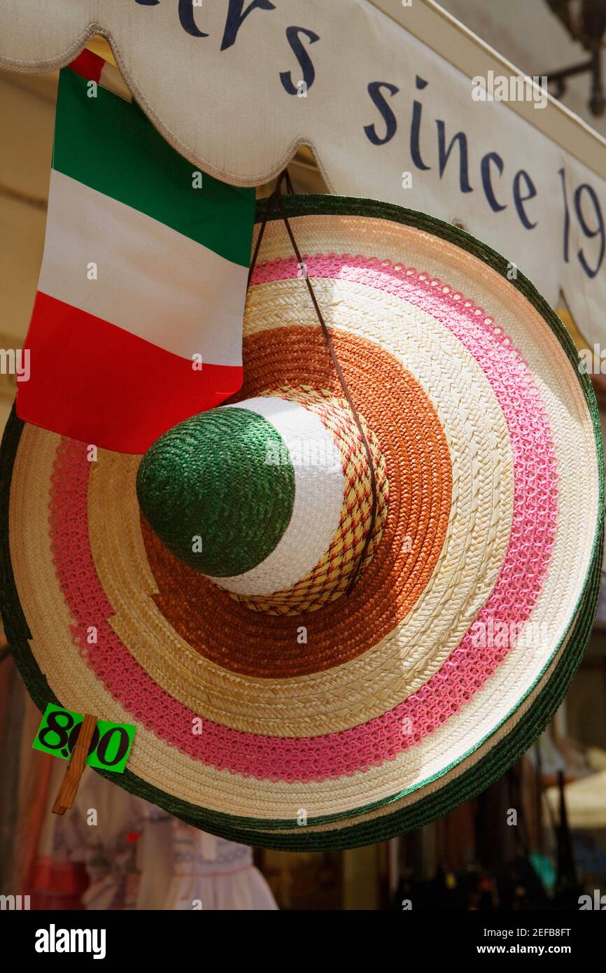 Sun hat hanging at a market stall, Sorrento, Sorrentine Peninsula ...