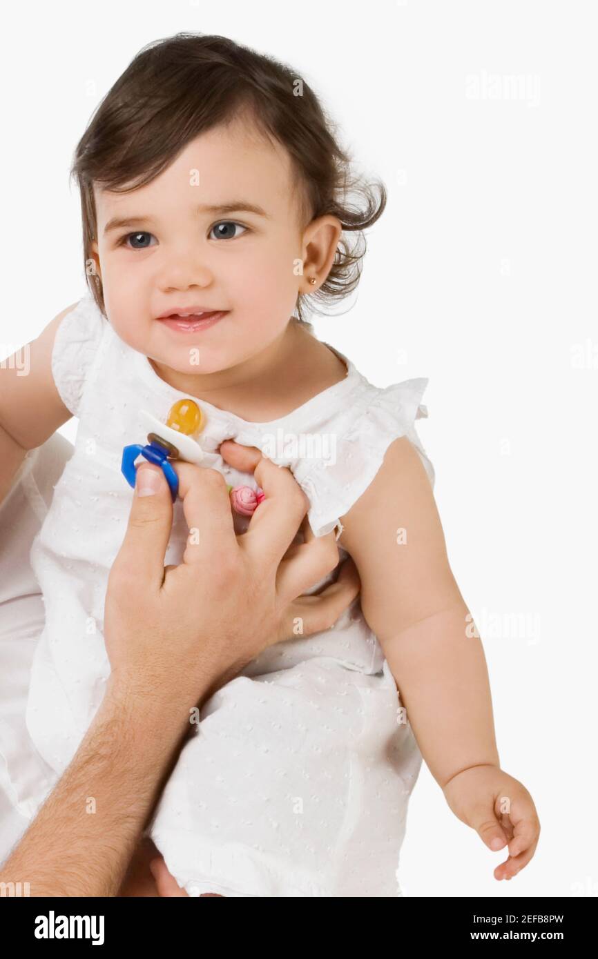 Girl holding pacifier hi-res stock photography and images - Alamy