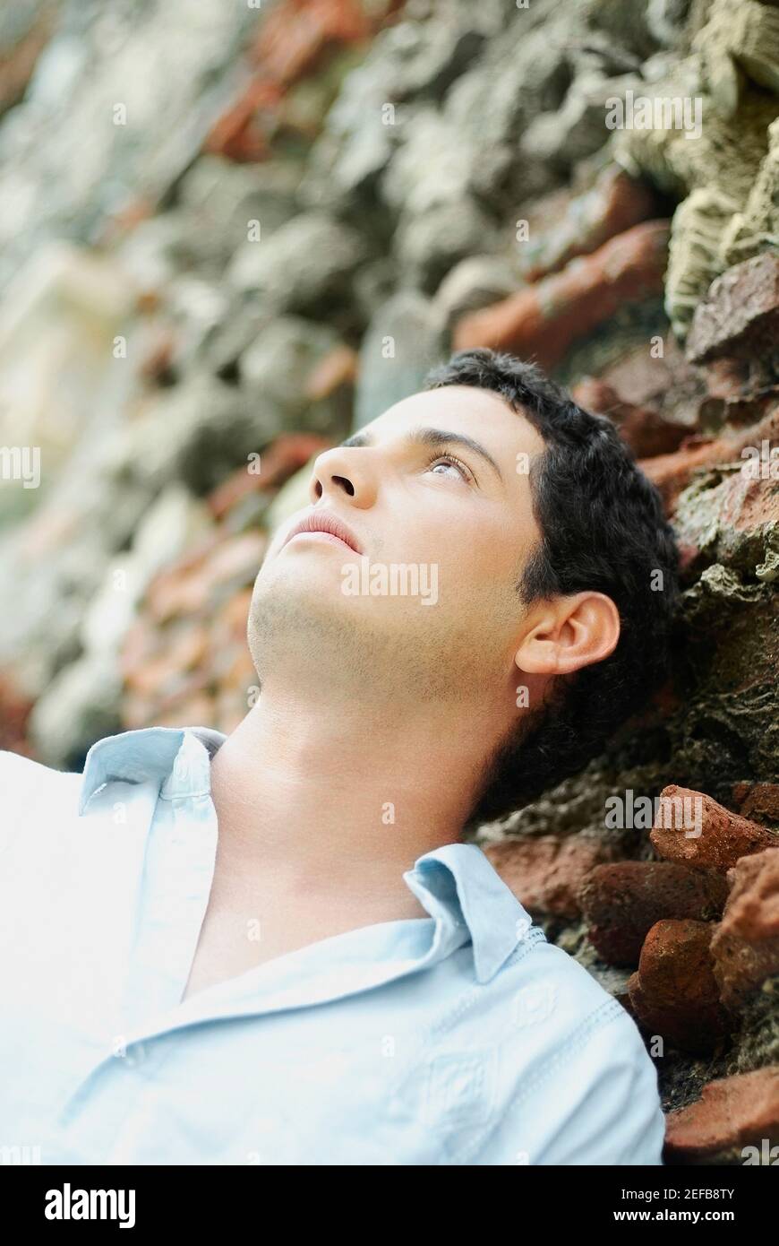 Upset man leaning against wall hi-res stock photography and images - Alamy