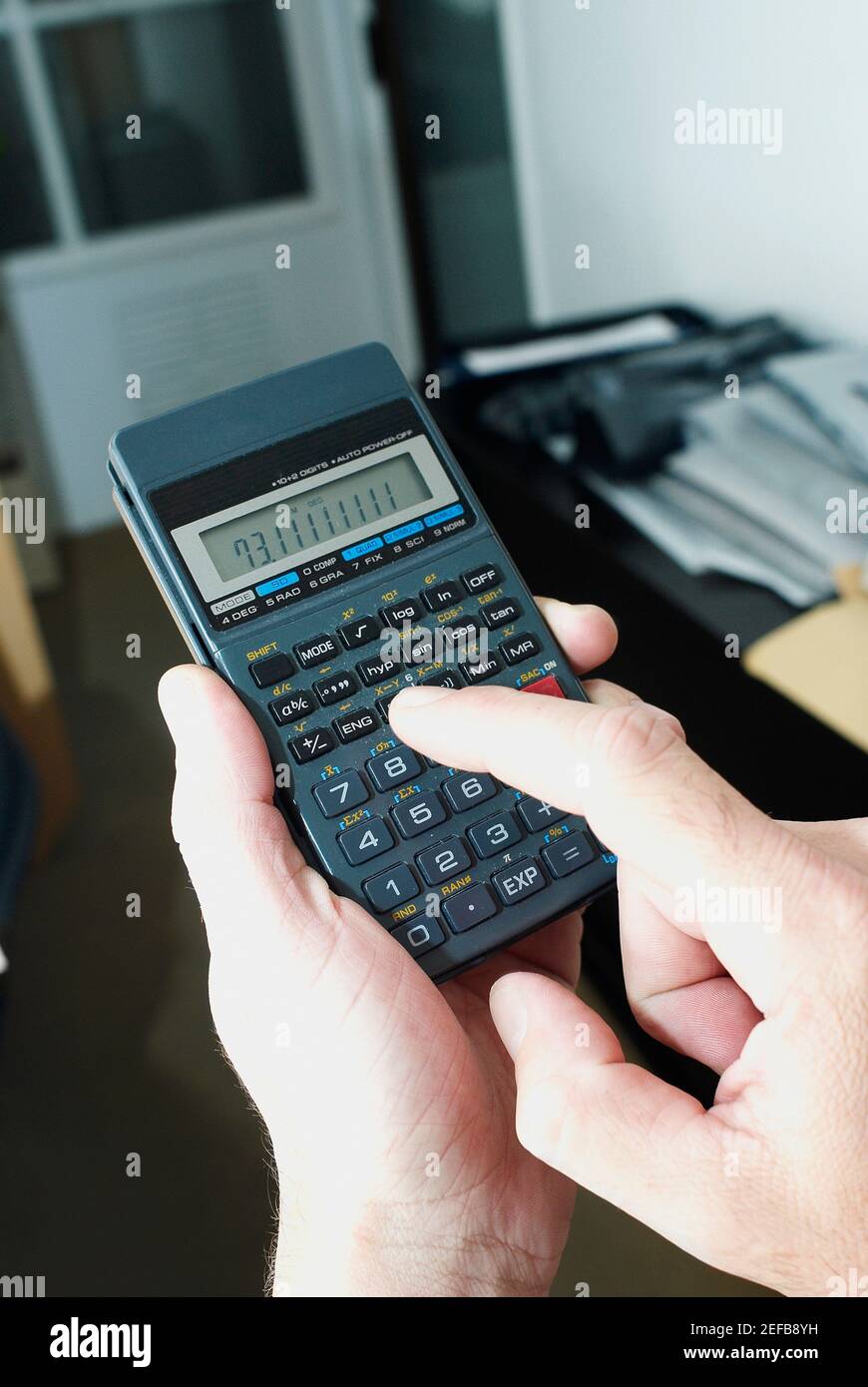 Business man pressing calculator hi-res stock photography and images ...