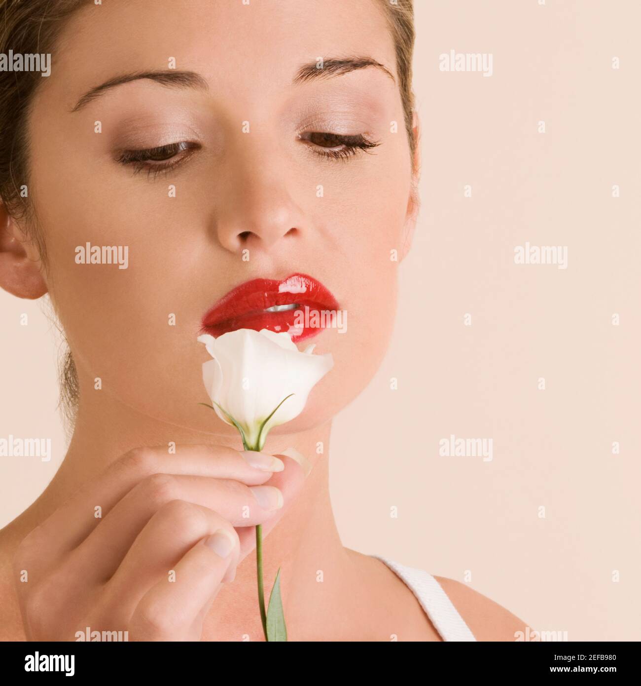 Woman sniffing rose hi-res stock photography and images - Alamy
