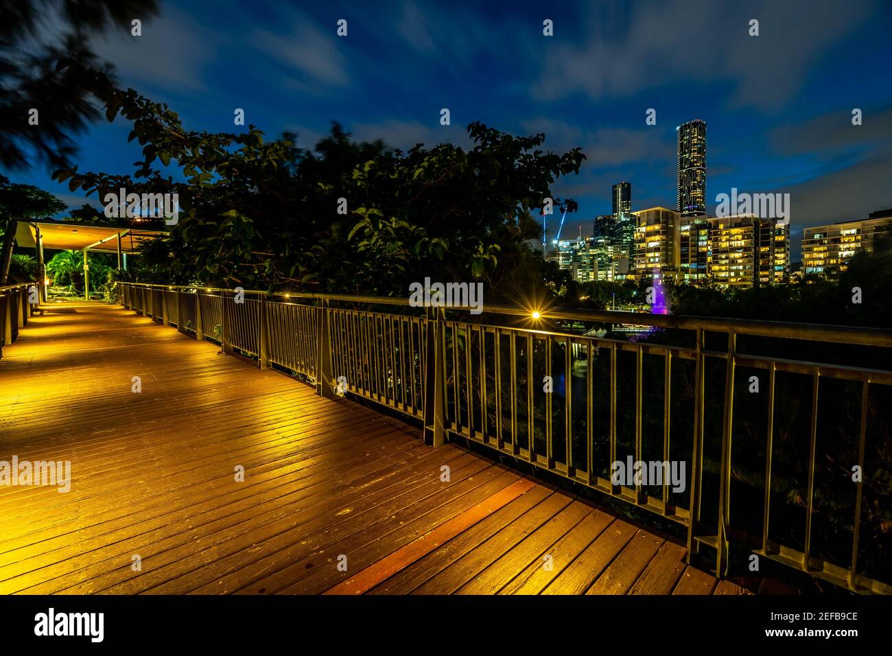 Suspended timber footpath with city views in the background in Roma ...