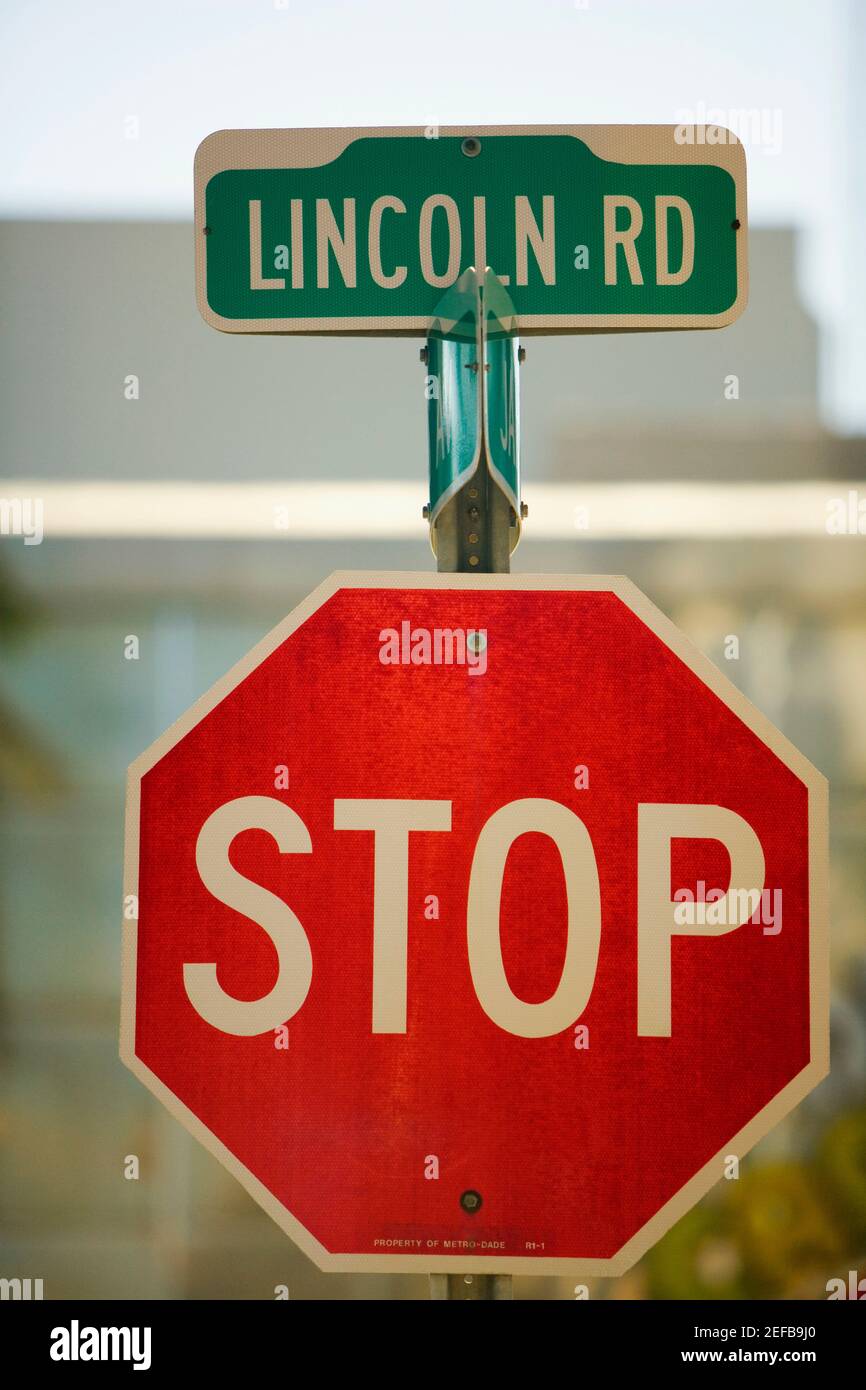 Close-up of a stop sign and a street name sign Stock Photo - Alamy