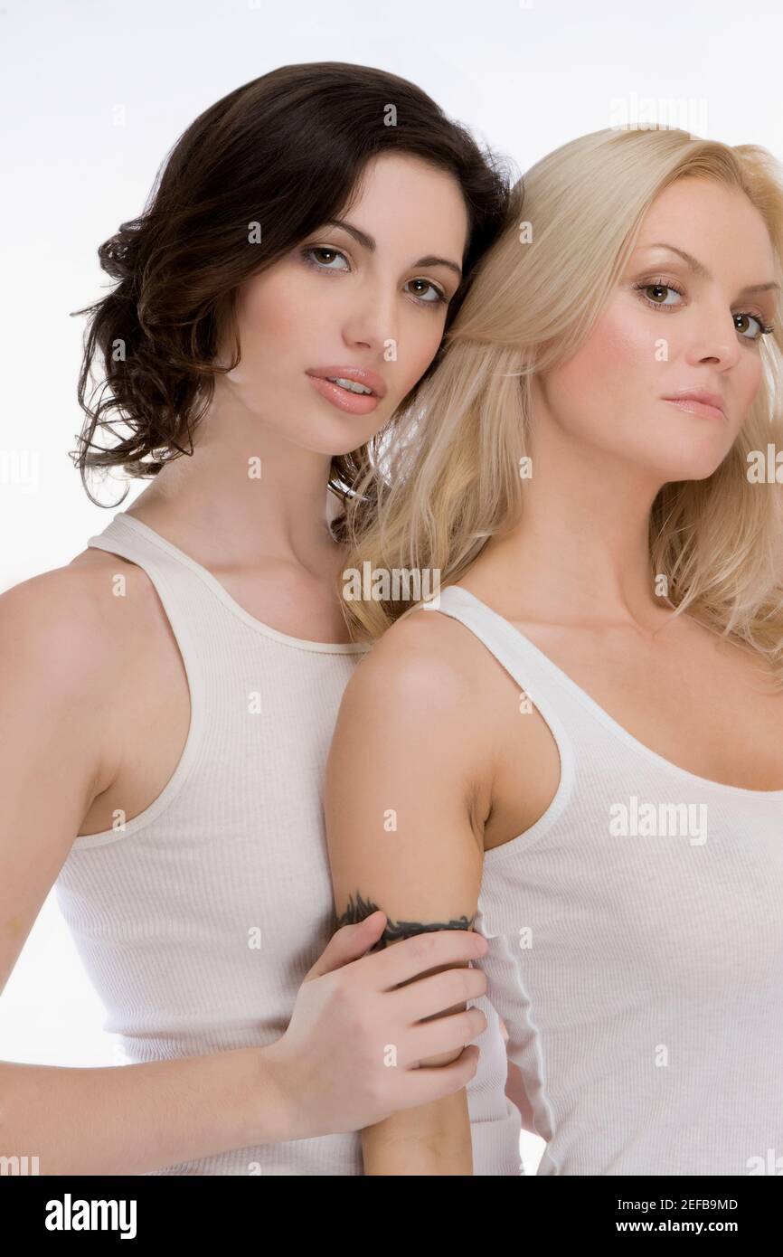 Portrait of two young women standing together Stock Photo - Alamy