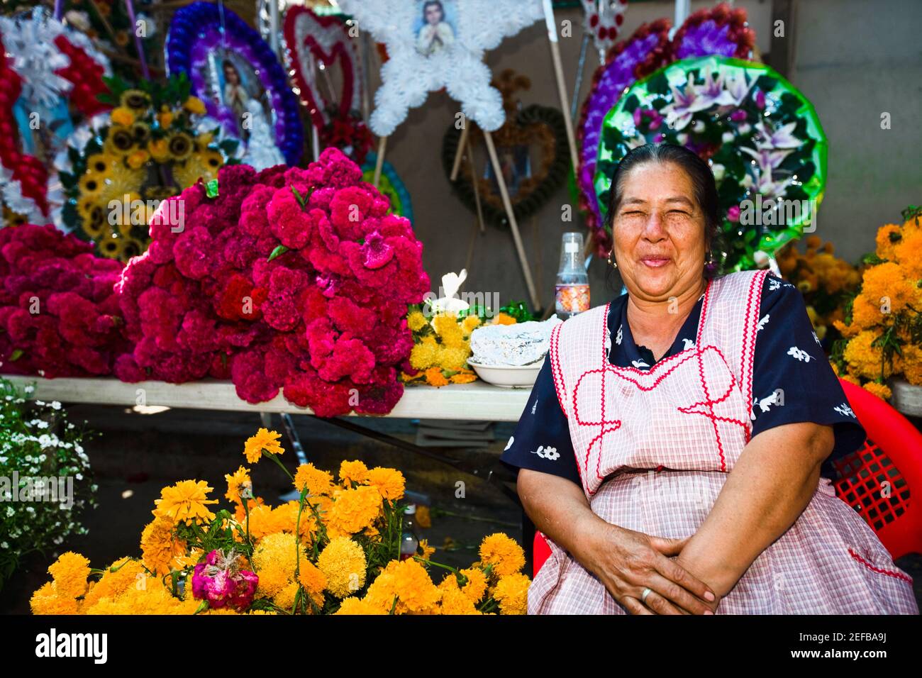 Senior woman selling flowers, San Juan Nuevo, Michoacan State, Mexico ...