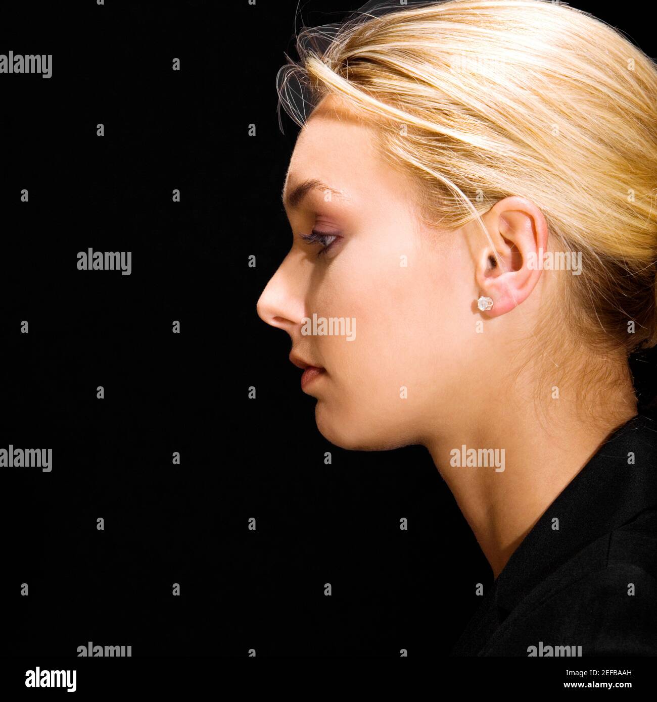 Side profile of a young woman thinking Stock Photo - Alamy
