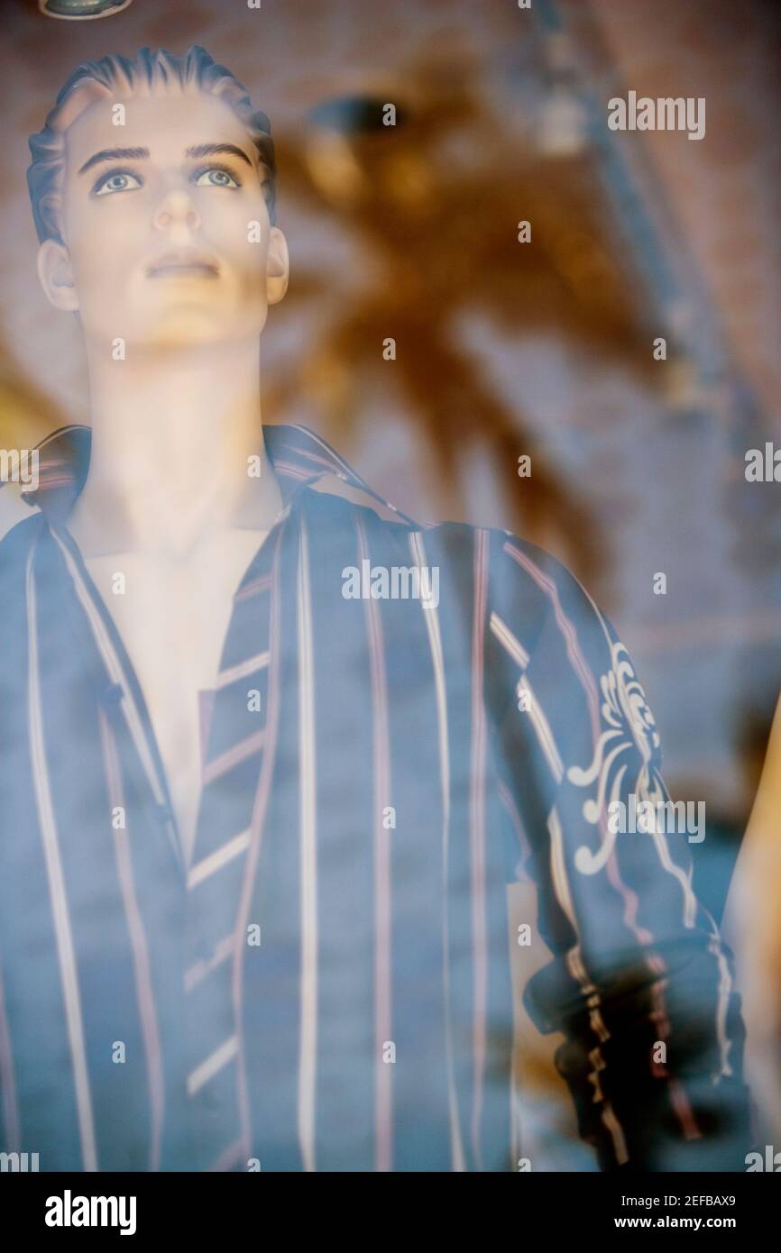 Male mannequin behind a glass window Stock Photo - Alamy