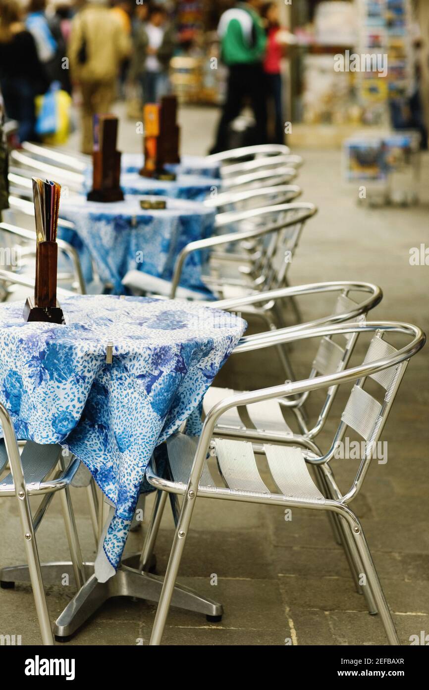 Tables and chairs in a restaurant Stock Photo - Alamy