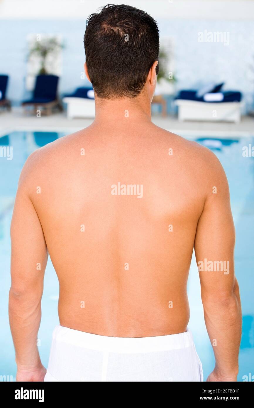 Rear view of a mid adult man Stock Photo - Alamy