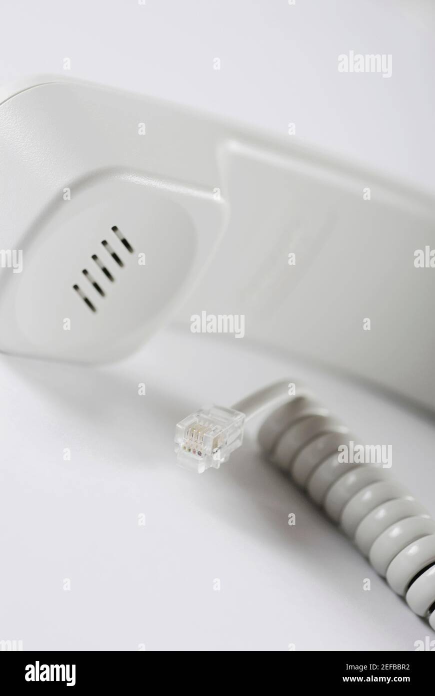 Close up of a telephone receiver with a spiral wire Stock Photo - Alamy