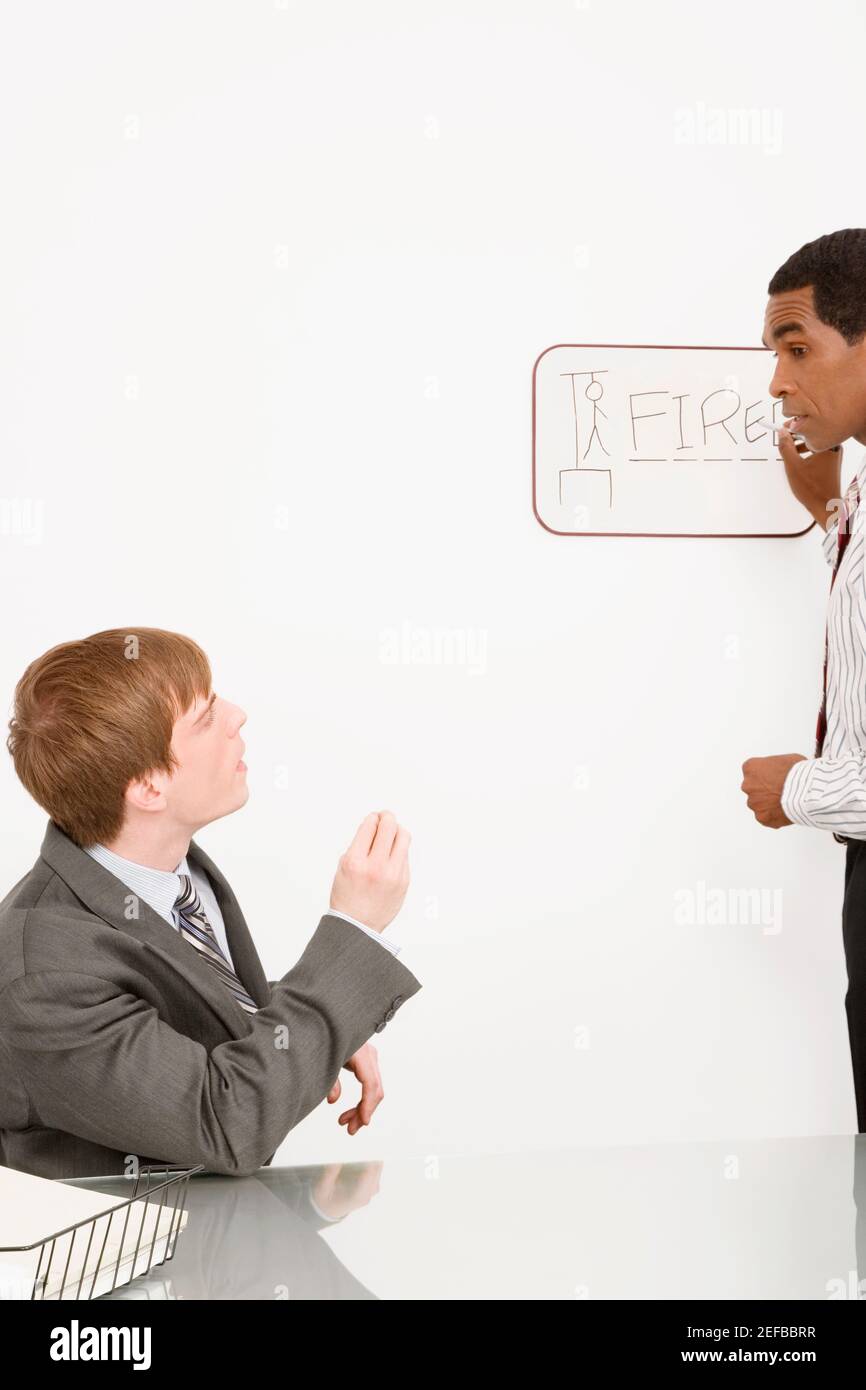 Manager sacking an employee Stock Photo - Alamy