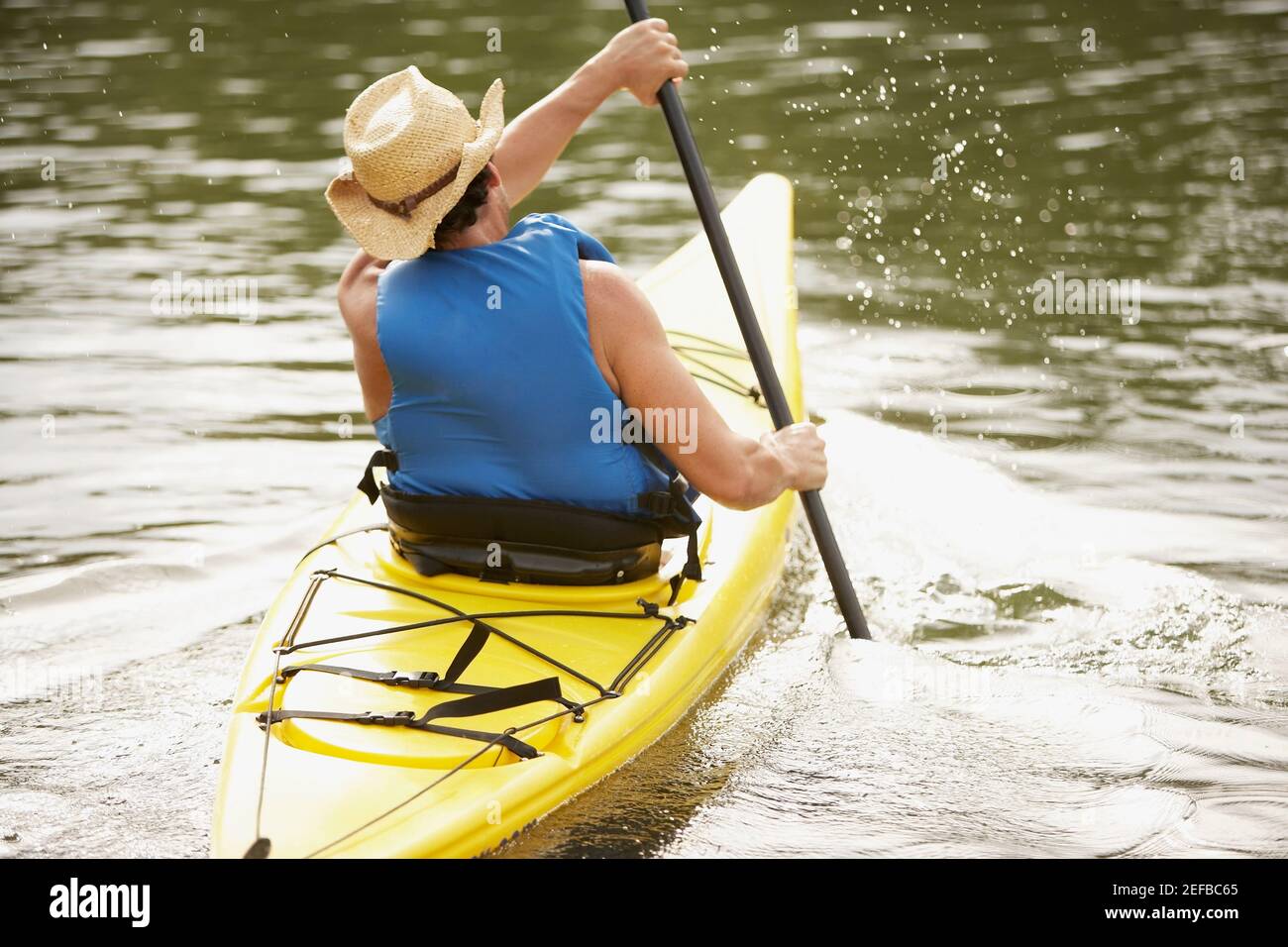 Rear view of a man kayaking hi-res stock photography and images - Alamy