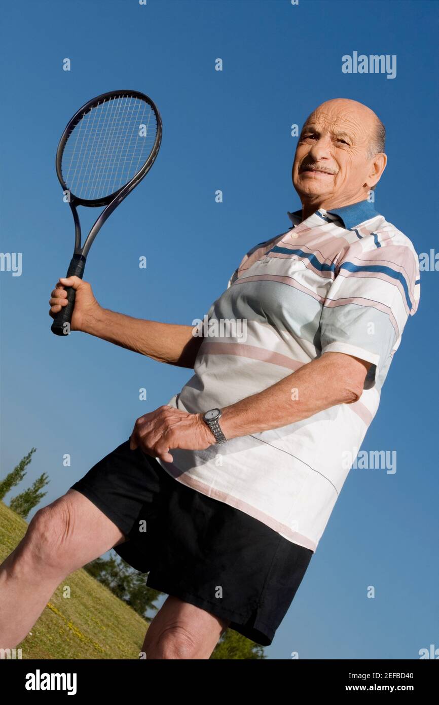 Senior man playing tennis Stock Photo - Alamy