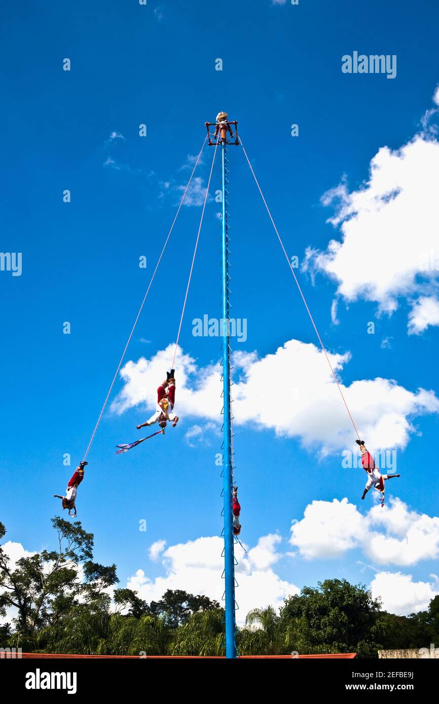 Man swinging from pole hi-res stock photography and images - Alamy