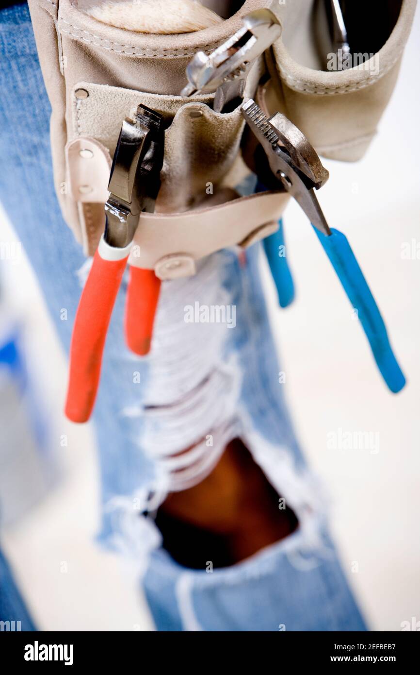 Close-up of work tools in a tool belt Stock Photo - Alamy