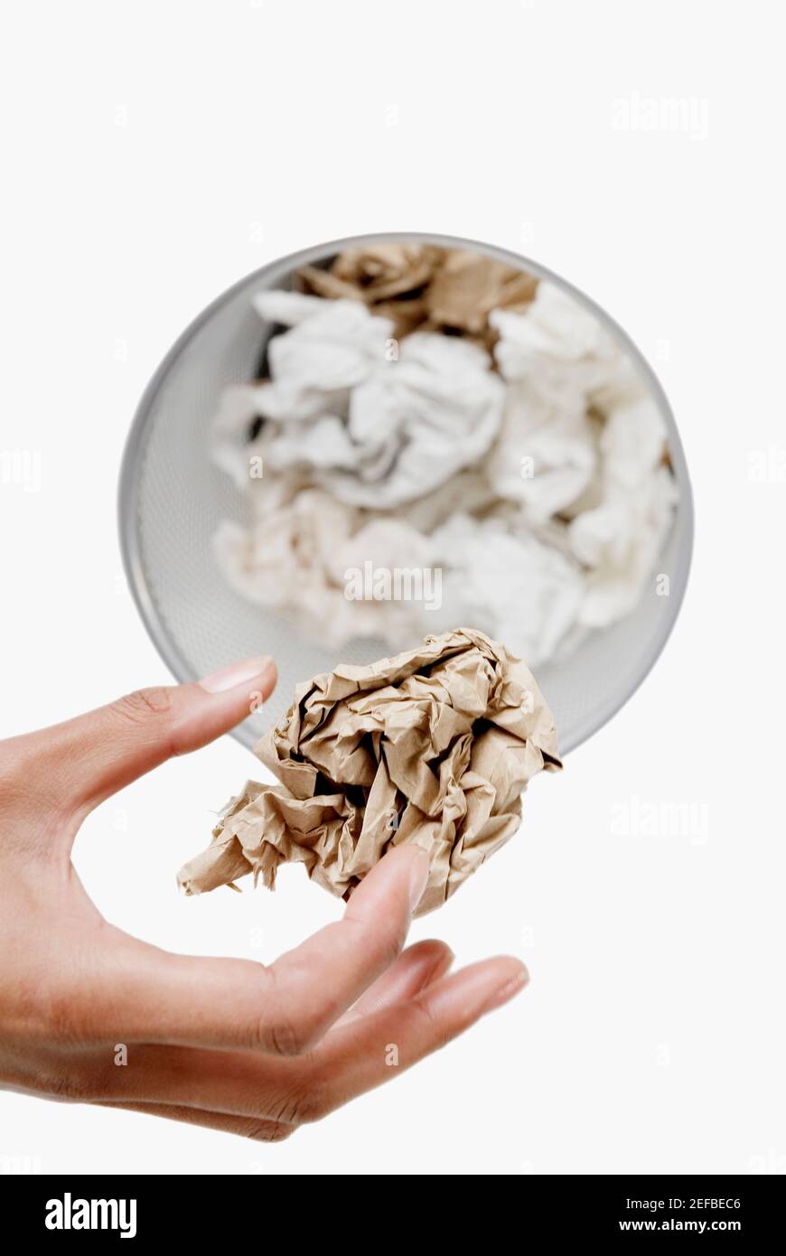 Close up of hand throwing crumpled paper in wastepaper basket Cut Out ...