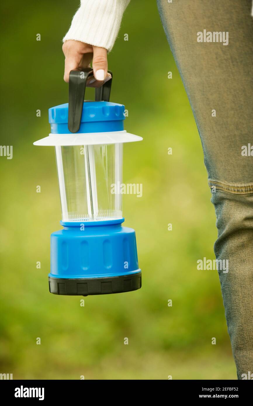 Hand holding lantern lamp hi-res stock photography and images - Alamy