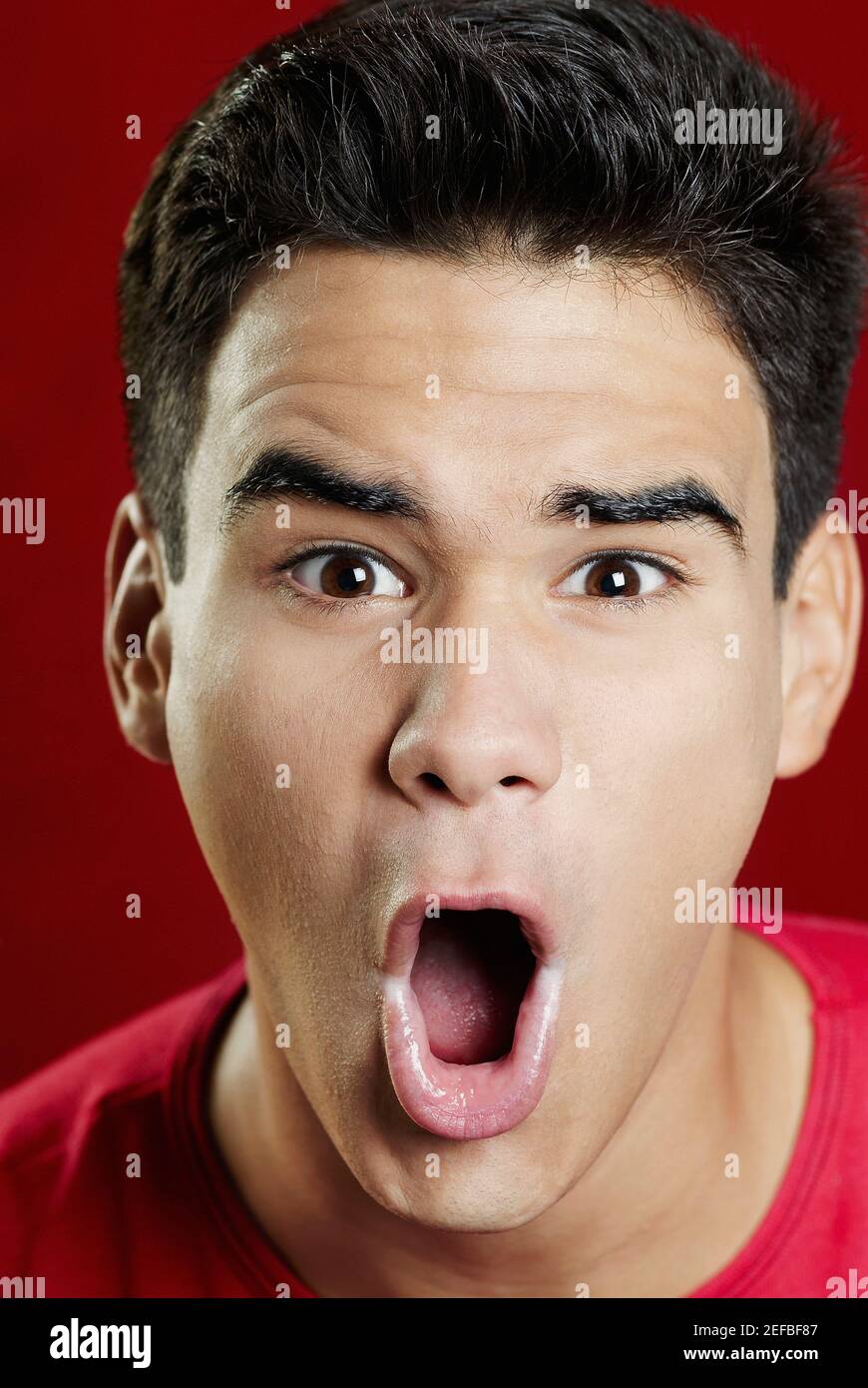 Portrait of a young man shouting Stock Photo - Alamy