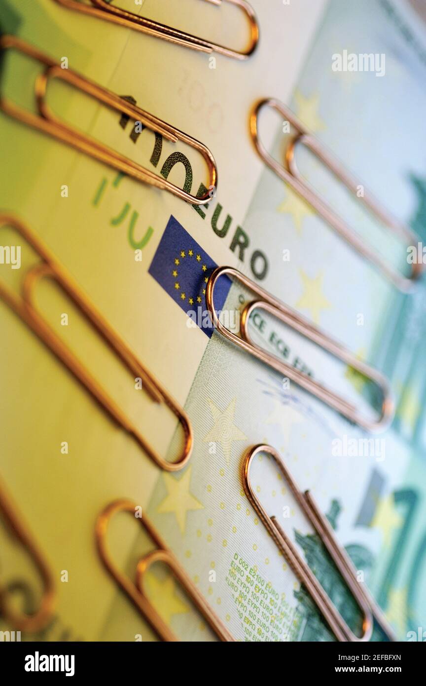 Close-up of paper clips on Euro banknotes Stock Photo - Alamy