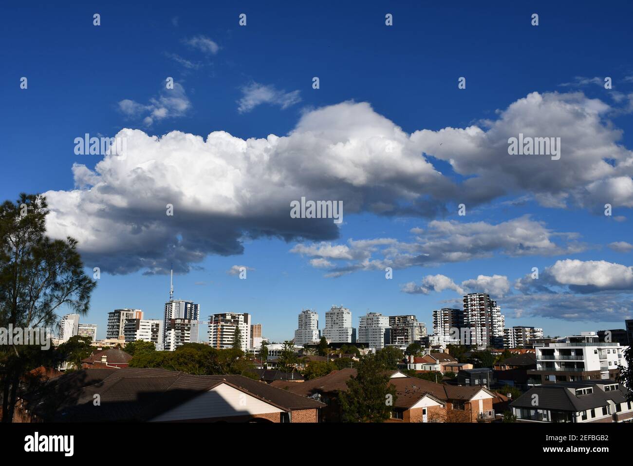 Beautiful cloud formation above city Stock Photo - Alamy