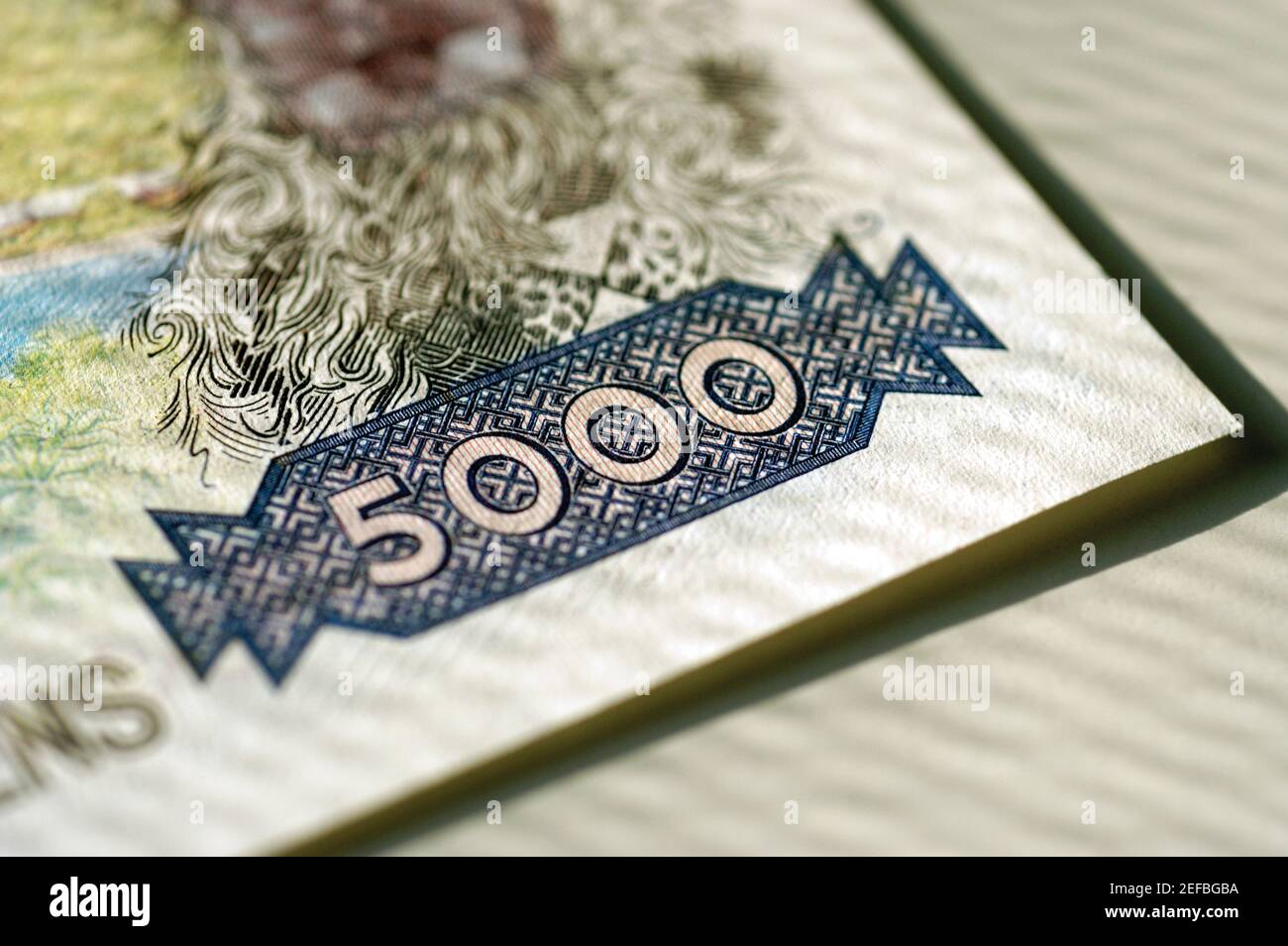 Corner of one 5000 bank note, close-up Stock Photo - Alamy