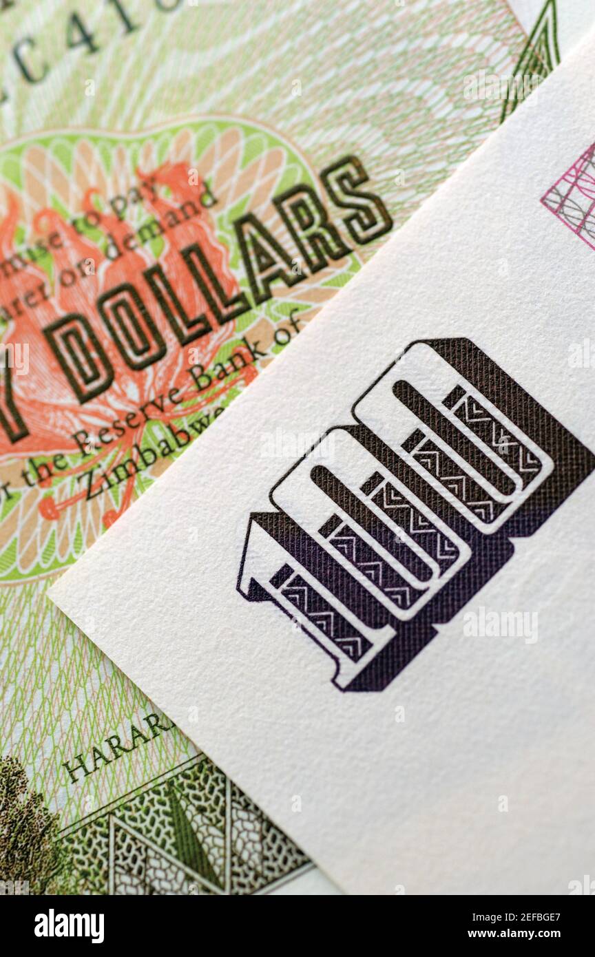 Zimbabwe bank note and paper with number 100, close-up Stock Photo - Alamy