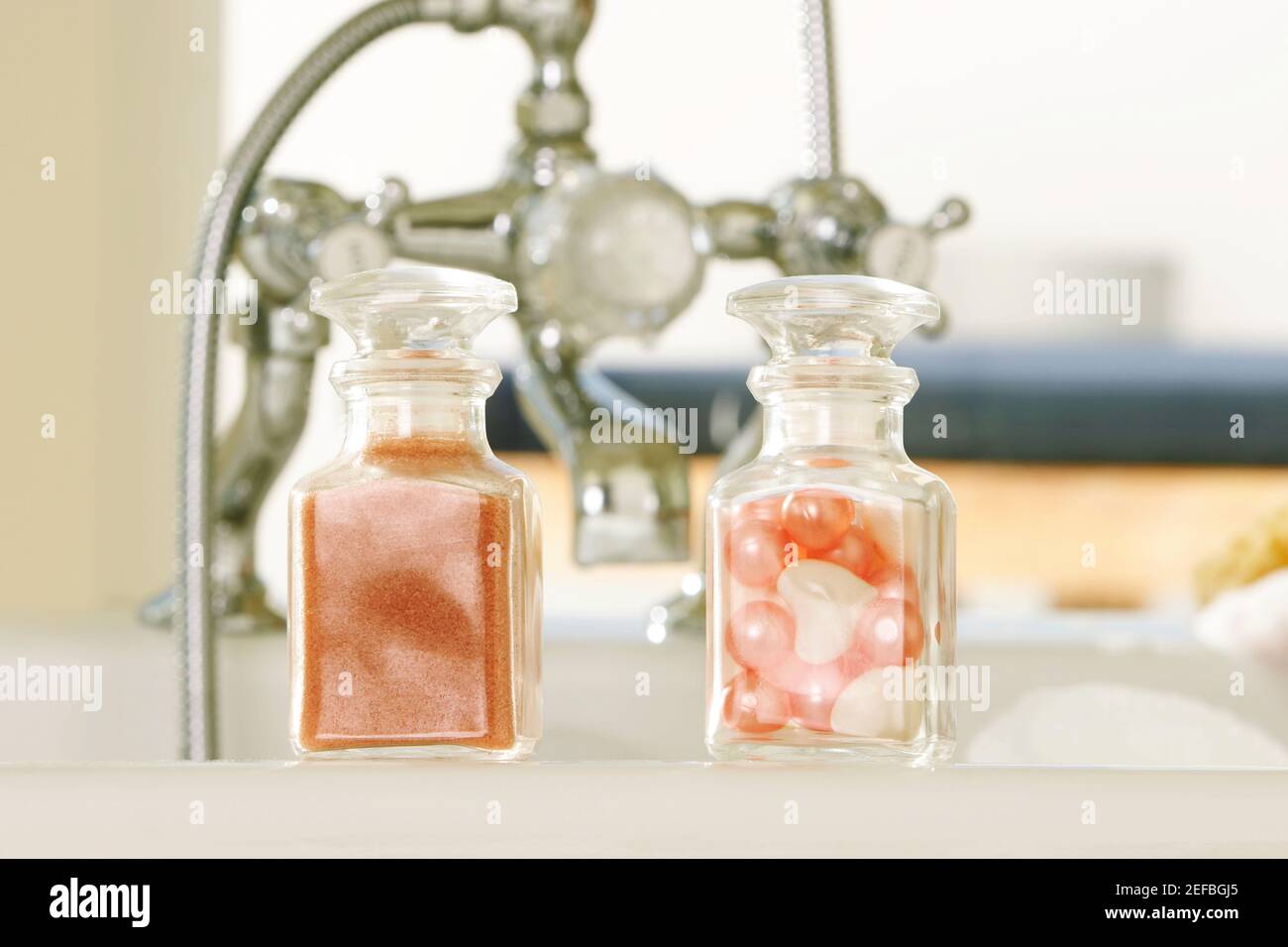 Close-up of soap powder and bath pearls in glass bottles Stock Photo ...