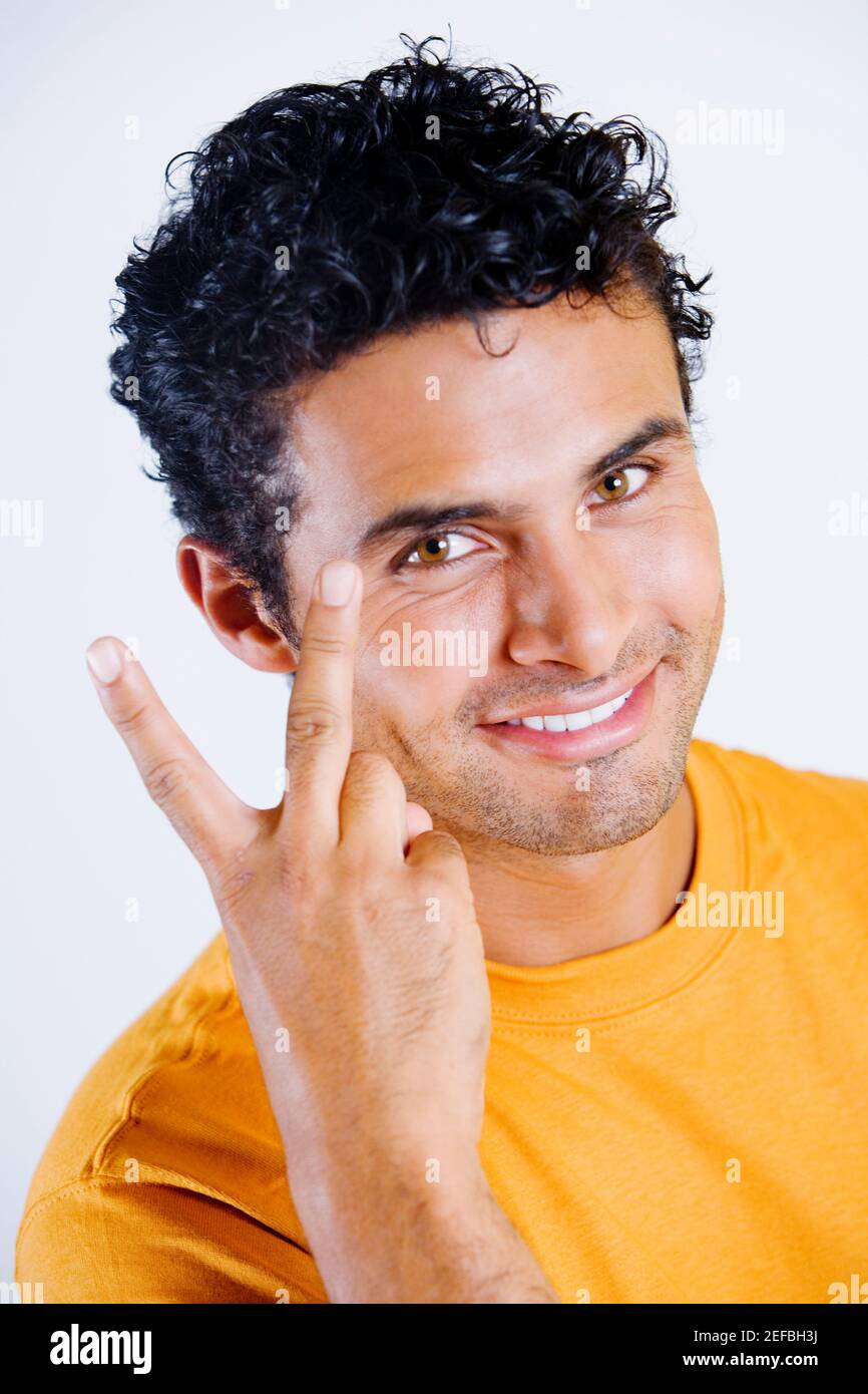 Black man making peace sign hi-res stock photography and images - Alamy