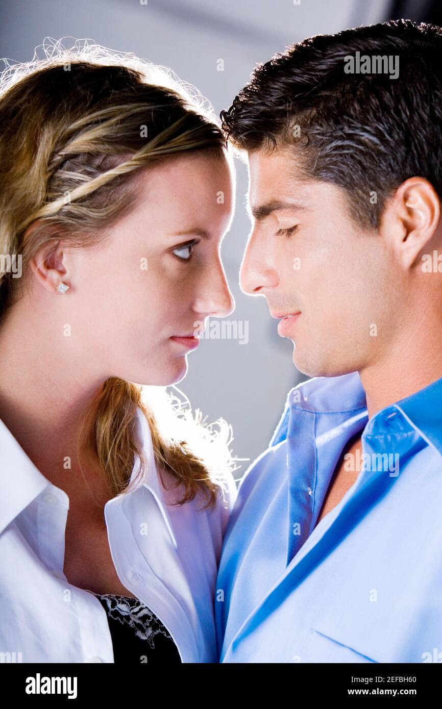 Close-up of a young woman and a mid adult man face to face Stock Photo ...