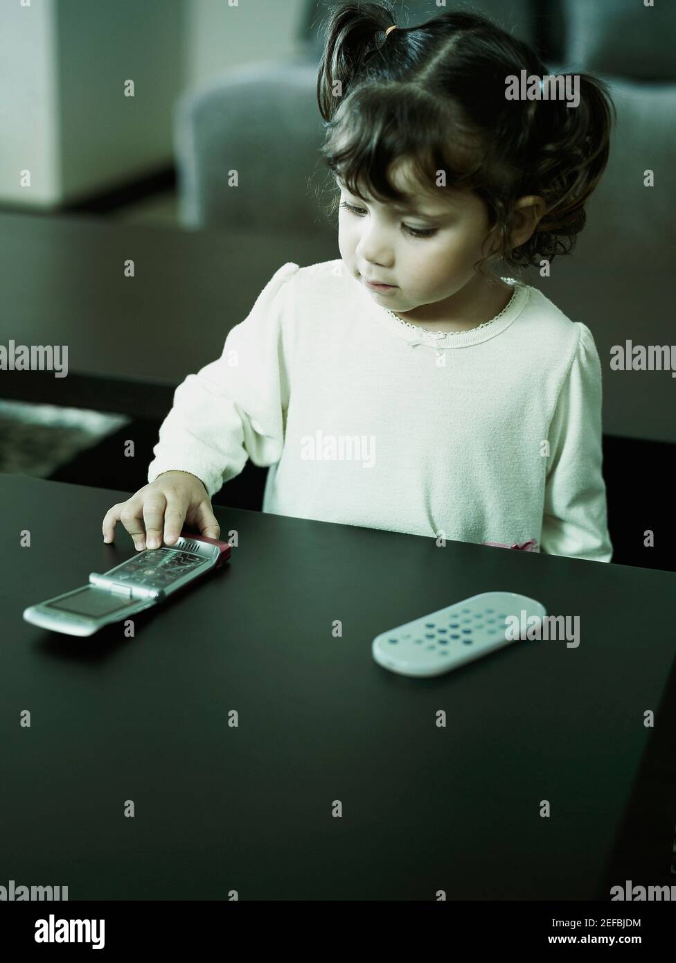 Girl dialing a mobile phone Stock Photo - Alamy