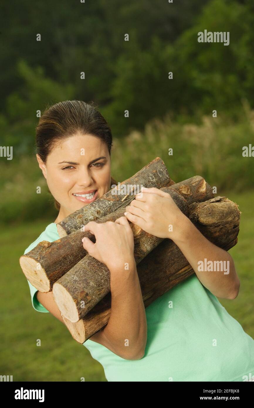 A woman carrying firewood hi-res stock photography and images - Alamy