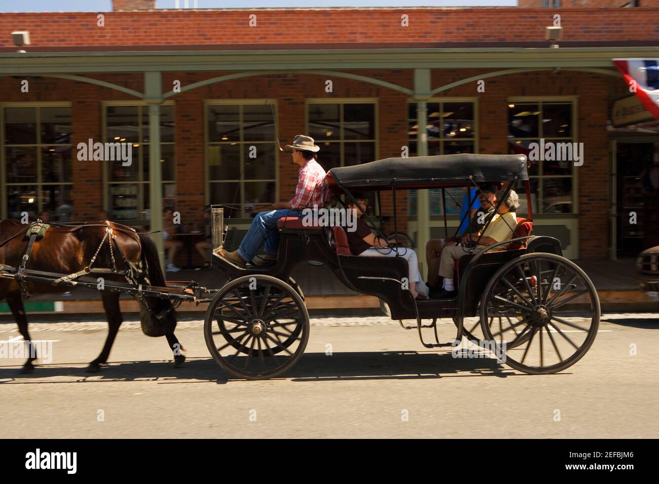 Side profile of a carriage in front of a store Stock Photo - Alamy