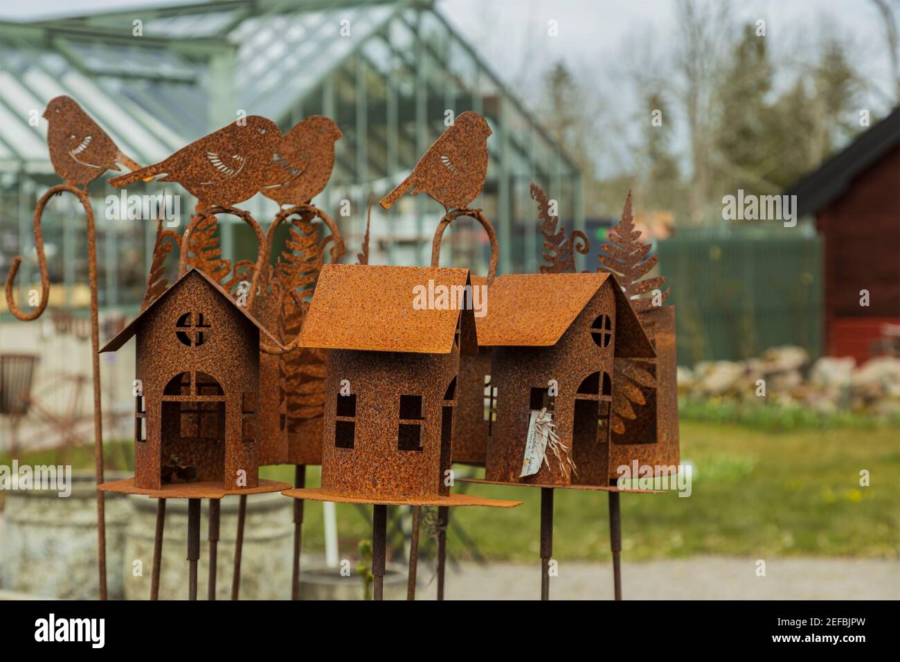 Cute metal birdhouses Stock Photo - Alamy